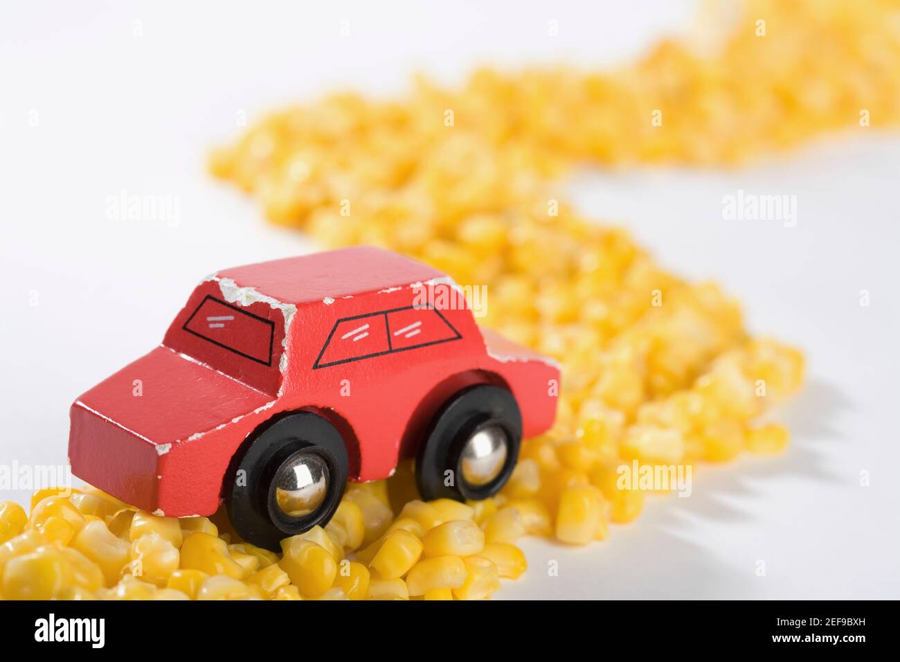 Close up of a toy car on a road made up of corns Stock Photo - Alamy