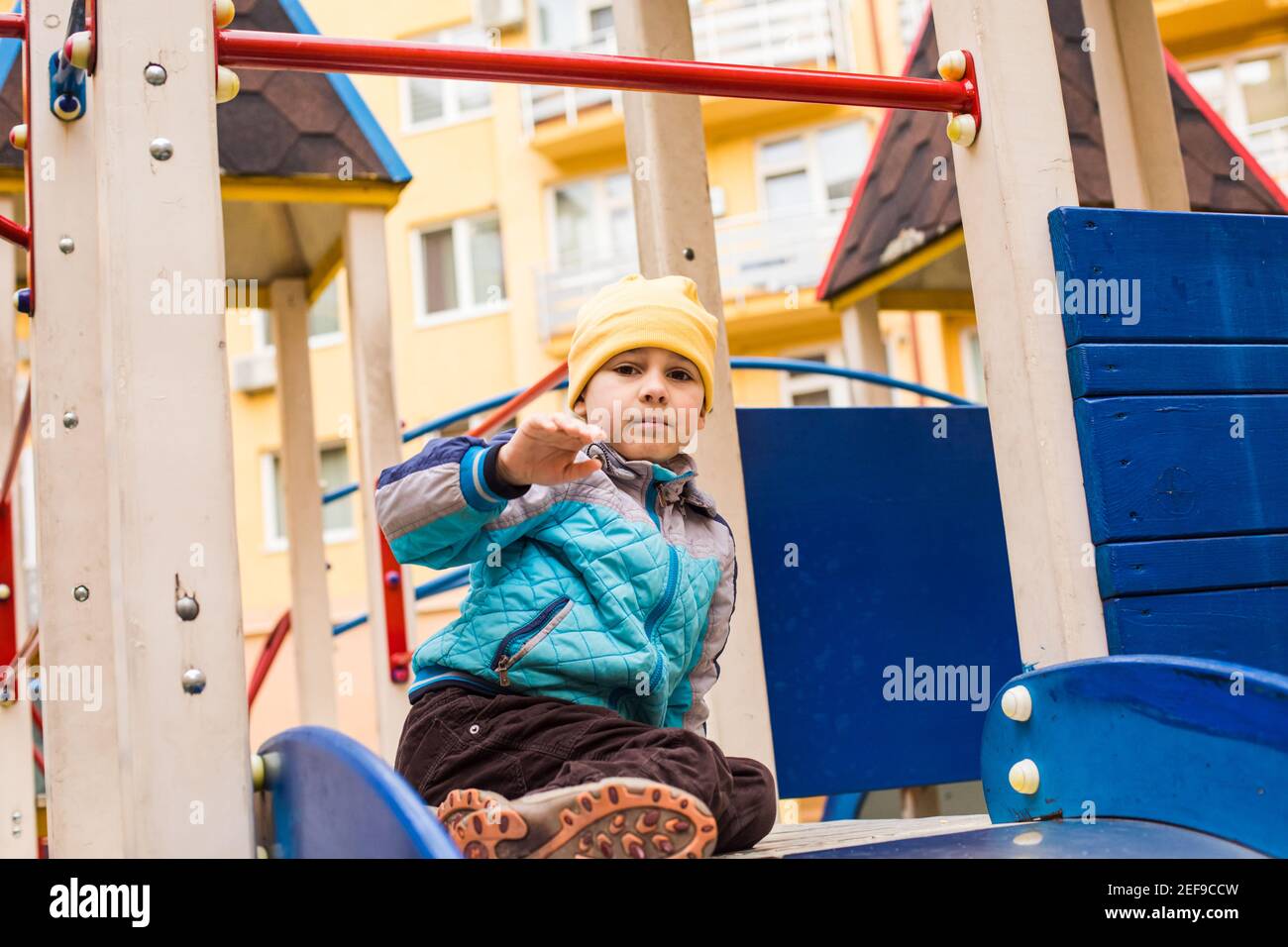 Sad boy play alone at playground outdoors Stock Photo - Alamy