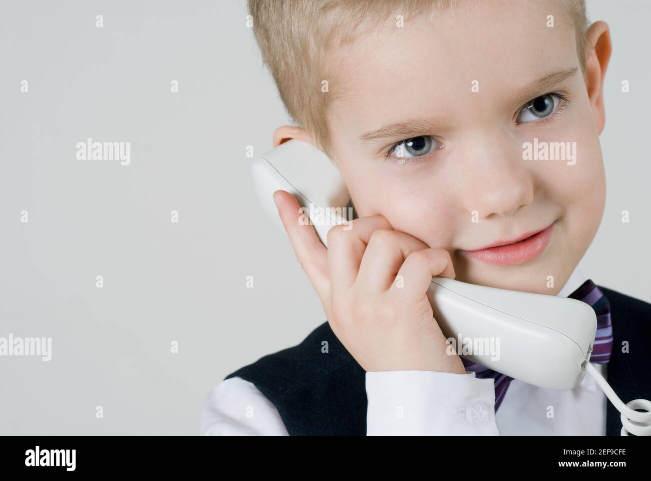 Elementary school kid talking on phone hi-res stock photography and ...