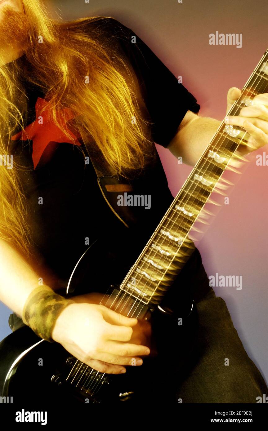 Mid section view of a musician playing the electric guitar Stock Photo ...