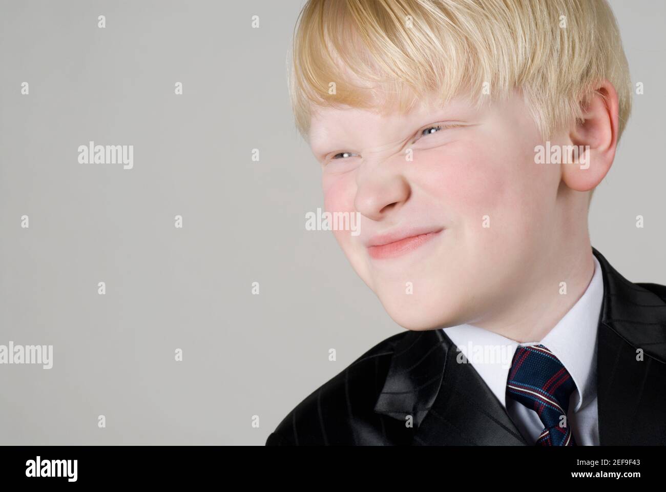 Close up of a boy smirking Stock Photo - Alamy