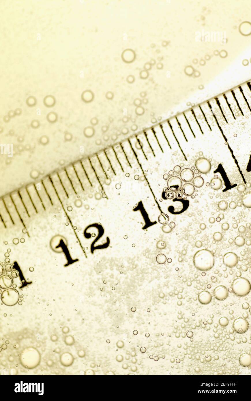 Close-up of a ruler in water Stock Photo - Alamy