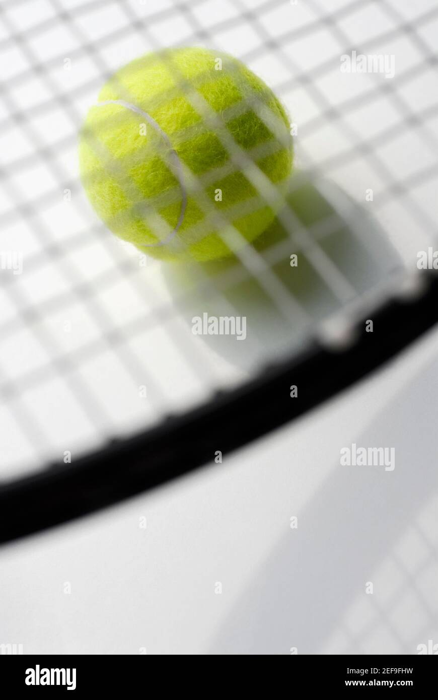 Close-up of a tennis racket on a tennis ball Stock Photo - Alamy