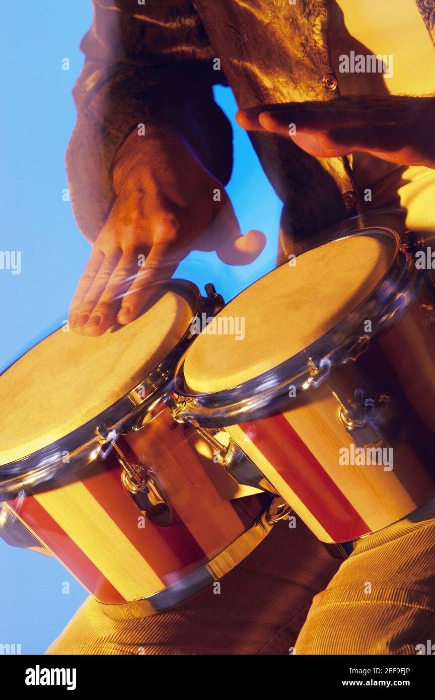 Mid section view of a musician playing the bongo Stock Photo - Alamy
