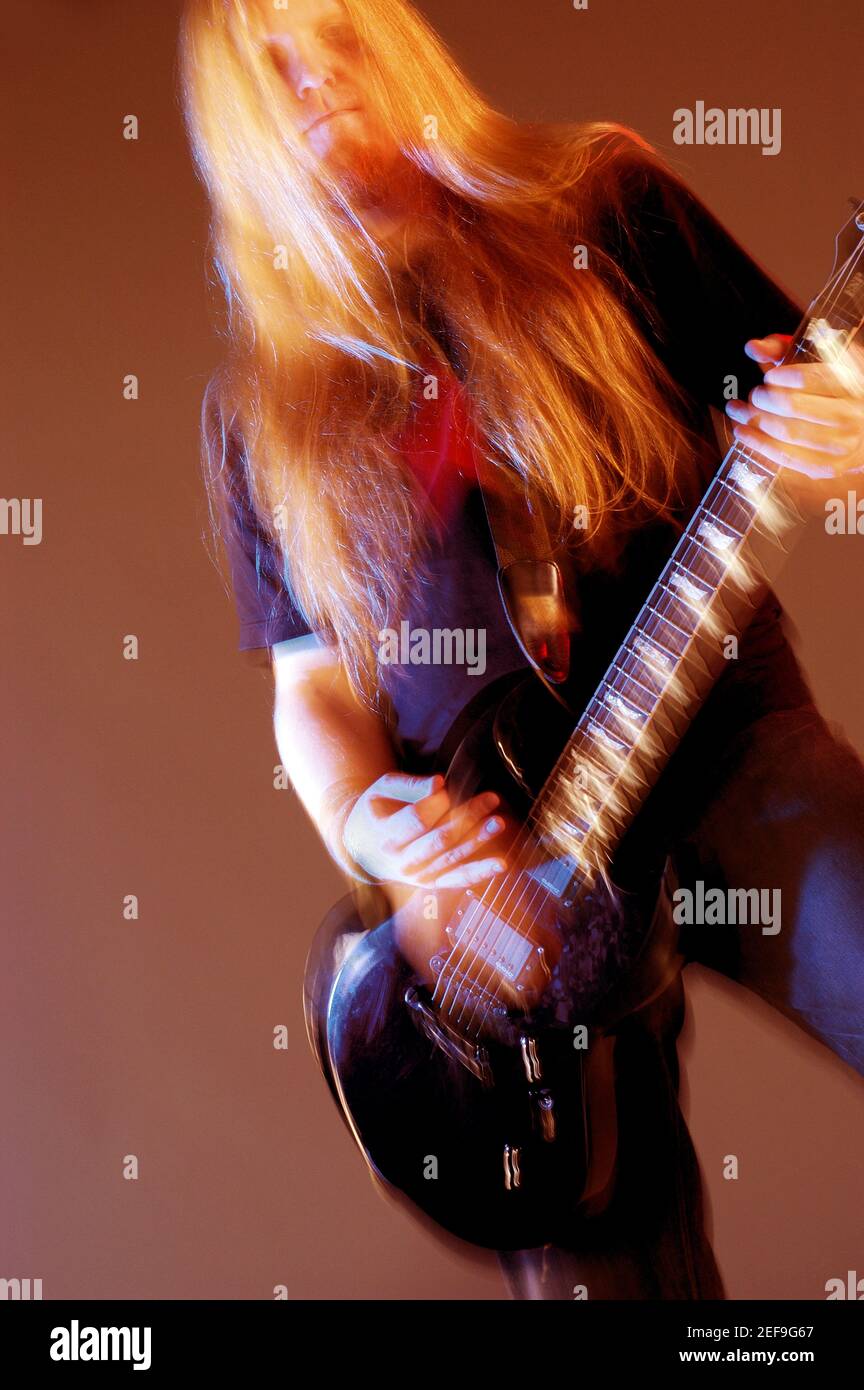 Skilled male guitarist playing electric hi-res stock photography and ...