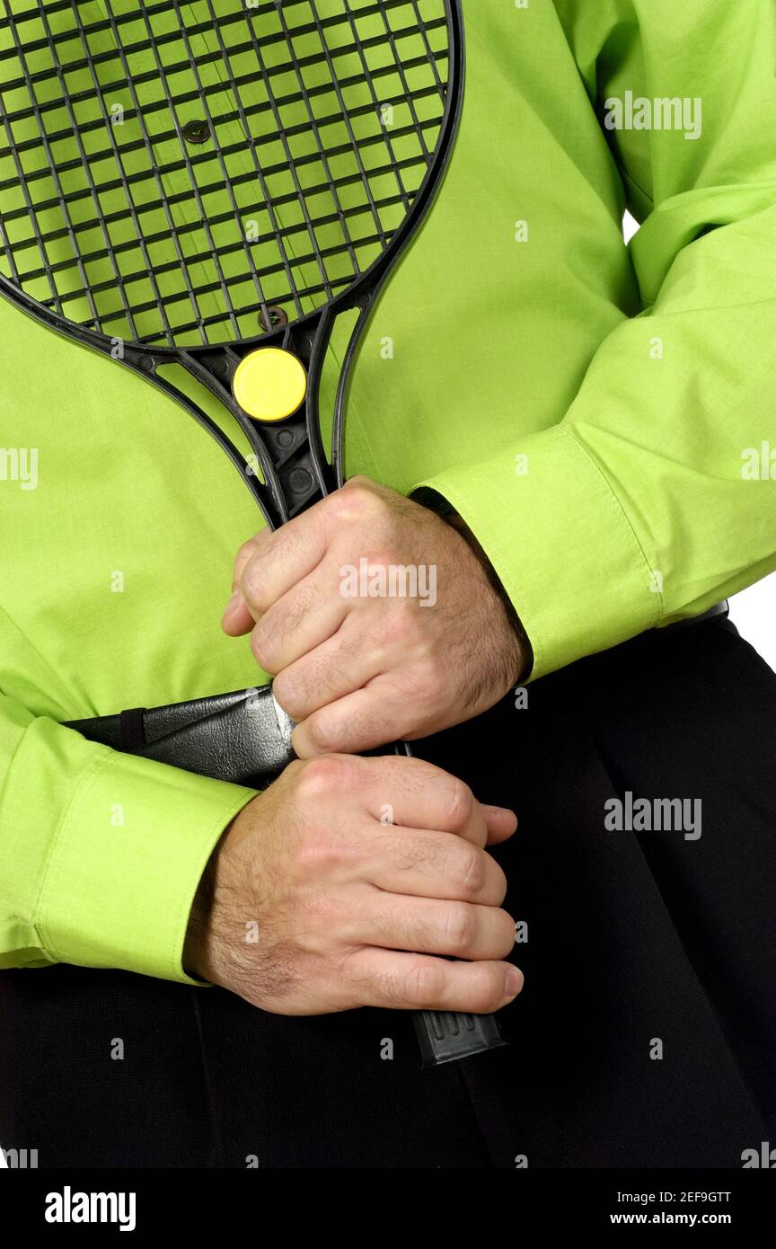 Mid section view of a man holding a tennis racket Stock Photo - Alamy