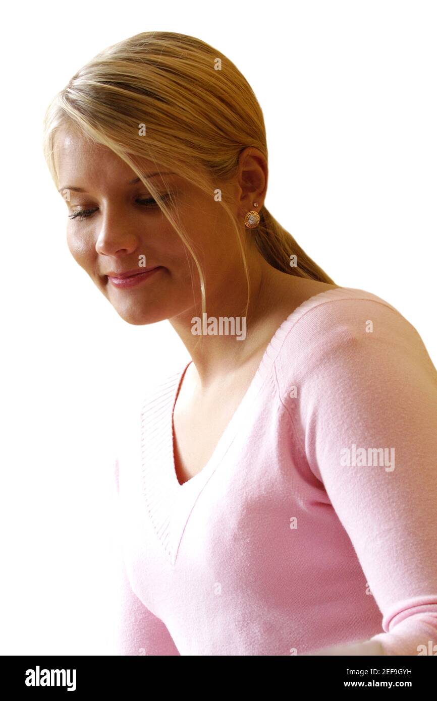 Beautiful woman smirking hi-res stock photography and images - Alamy