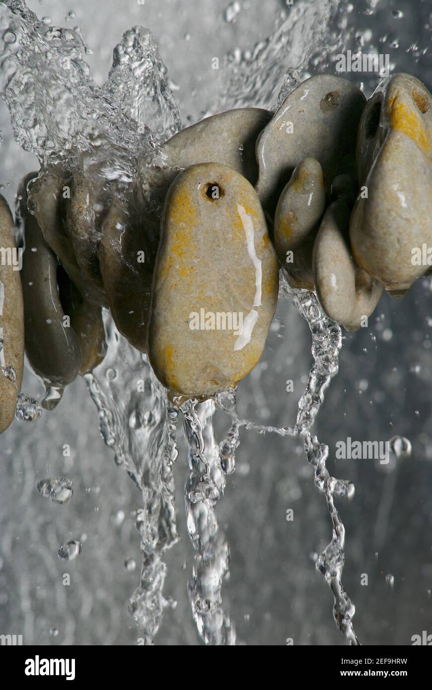 Stack of pebbles in water Stock Photo - Alamy