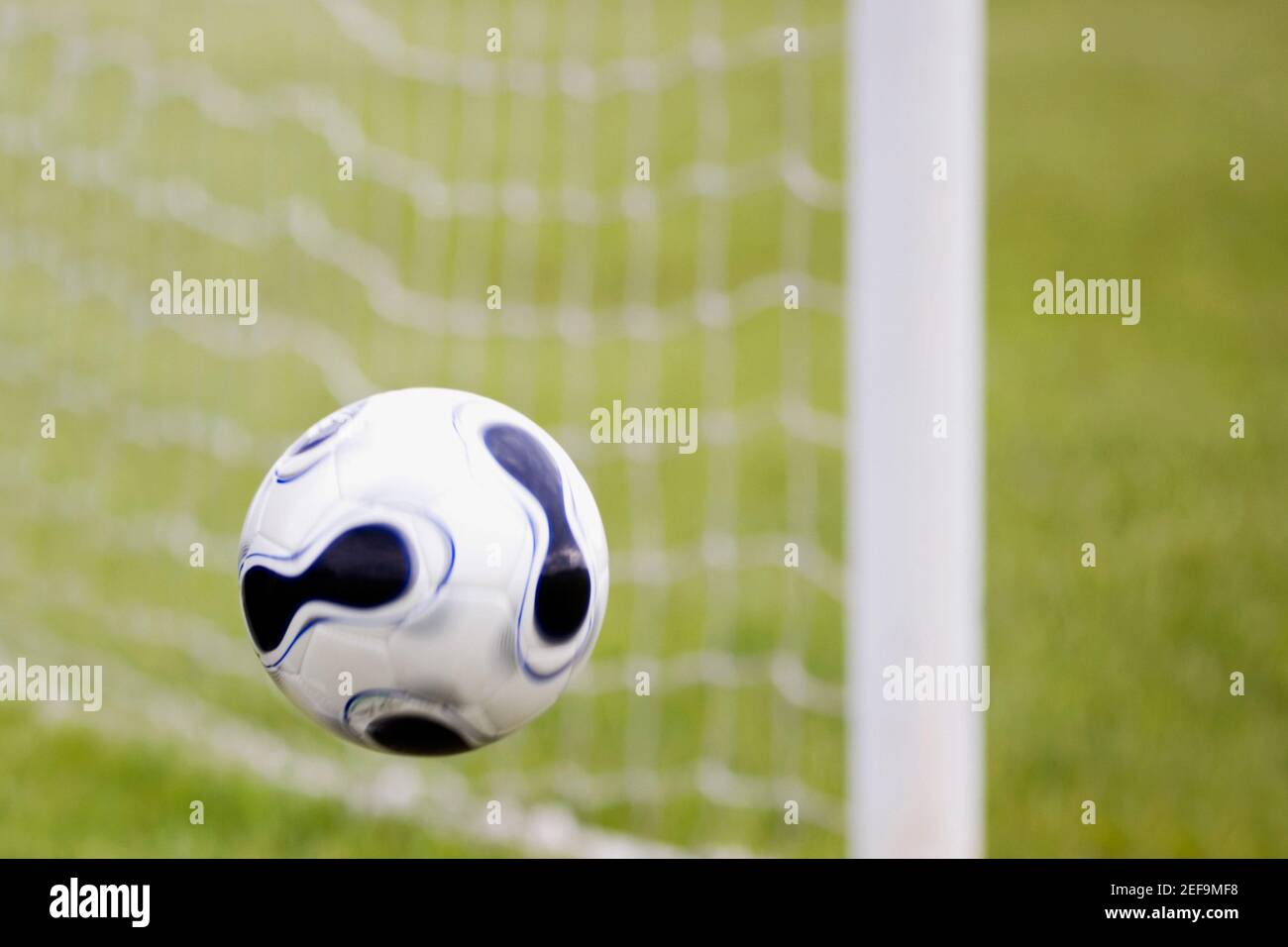 Close-up of a soccer ball in mid-air Stock Photo - Alamy