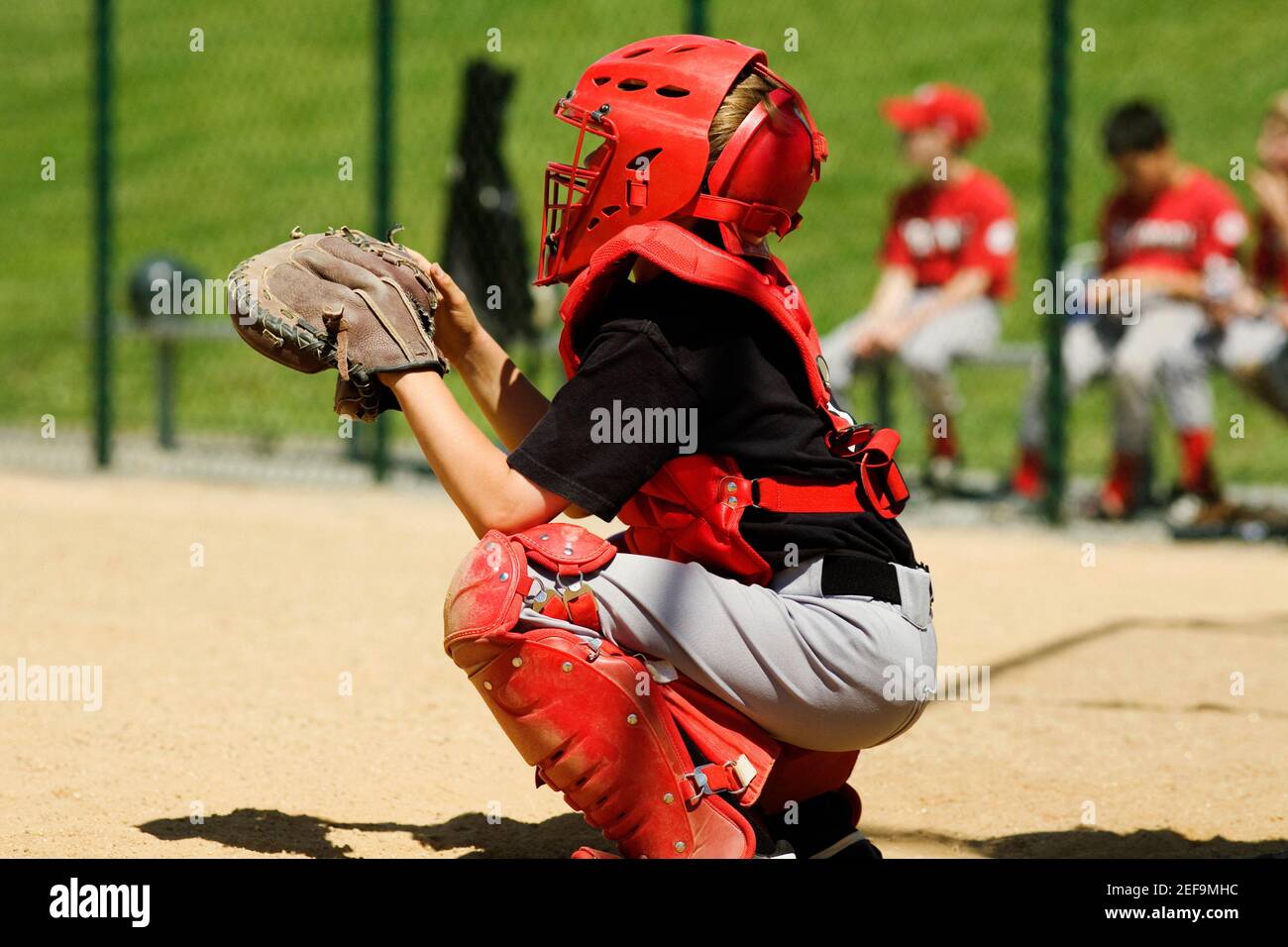Boy in catchers helmet hi-res stock photography and images - Alamy
