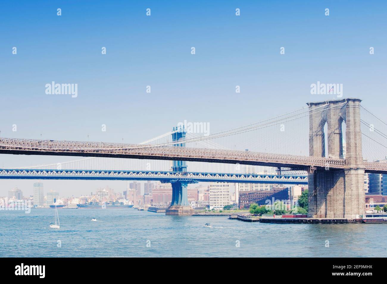 Suspension bridge across a river, Brooklyn Bridge, Manhattan, New York ...