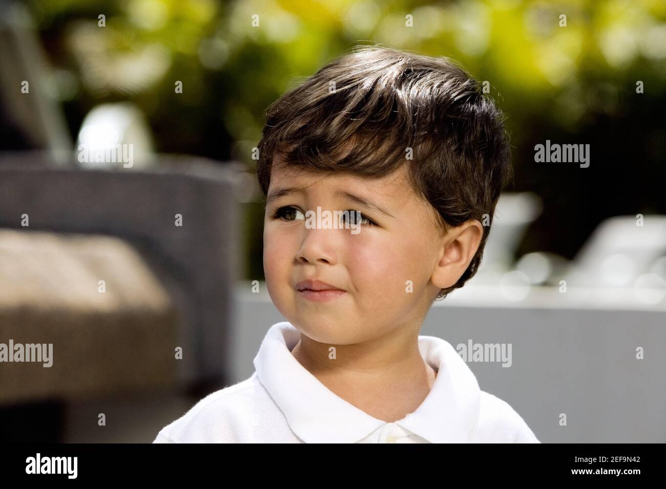 Close-up of a boy looking sad Stock Photo - Alamy