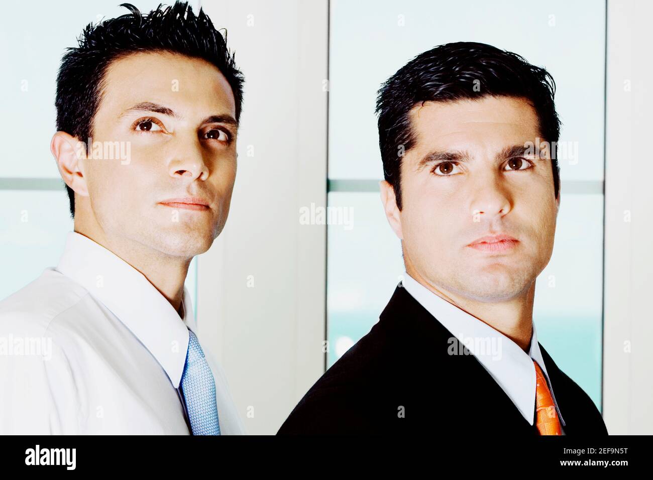 Side profile of two businessmen Stock Photo - Alamy