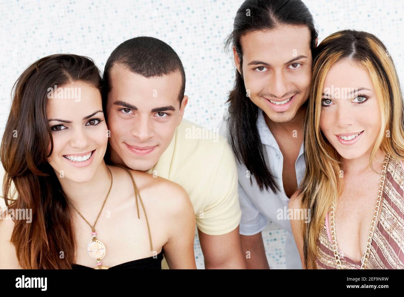 Portrait of two young couples smiling Stock Photo - Alamy