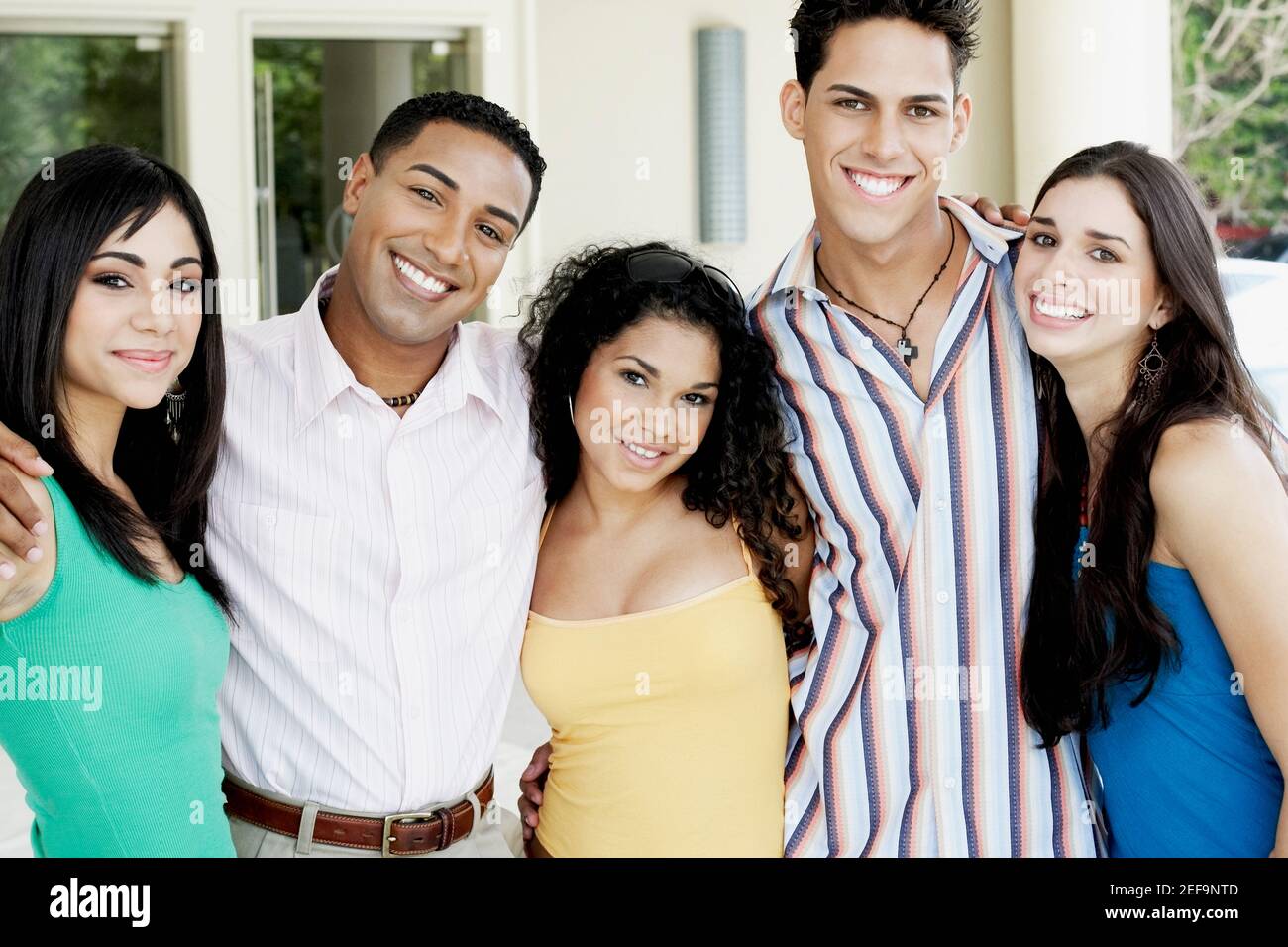Portrait of a group of friends standing side by side and smiling Stock ...