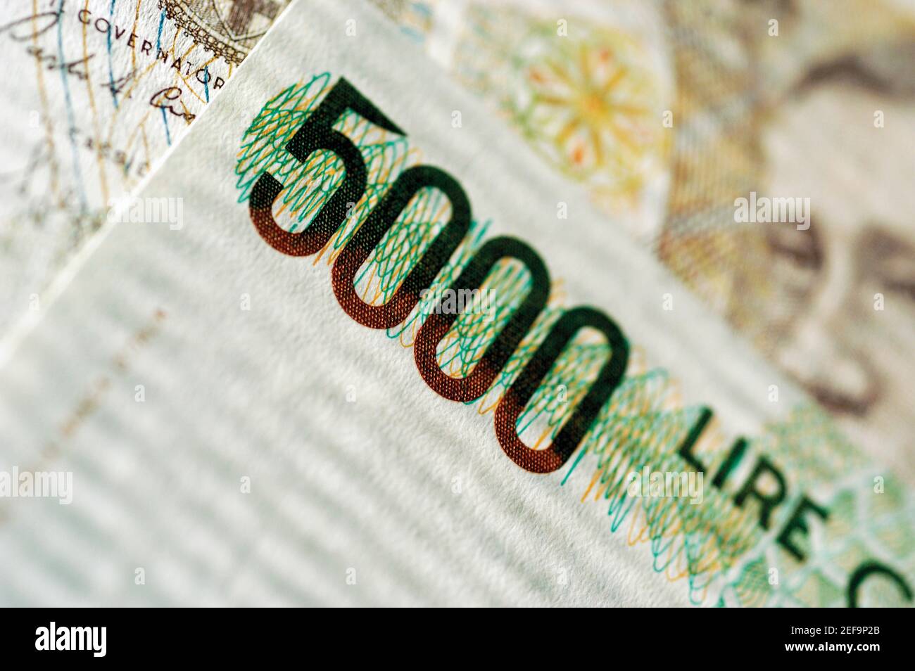 One 5000 Lire bank note on top of other currency, close-up Stock Photo ...