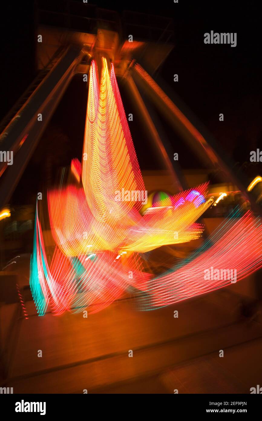 Lights glowing on a carnival ride at night, California, USA Stock Photo ...