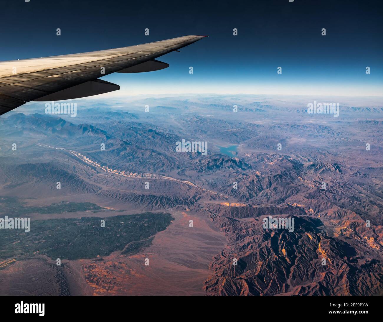 Aerial View from an Airplane. Flying above Beautiful Land at Sunrise ...