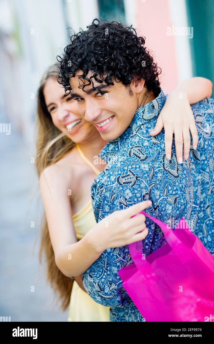 Close-up of a young man and a teenage girl embracing each other Stock ...