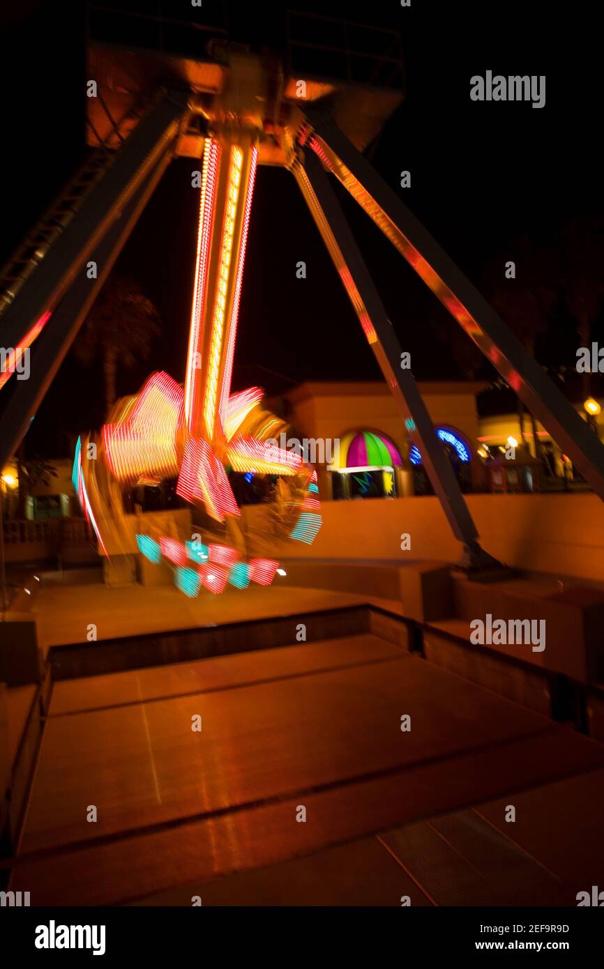 Lights glowing on a carnival ride at night, California, USA Stock Photo ...