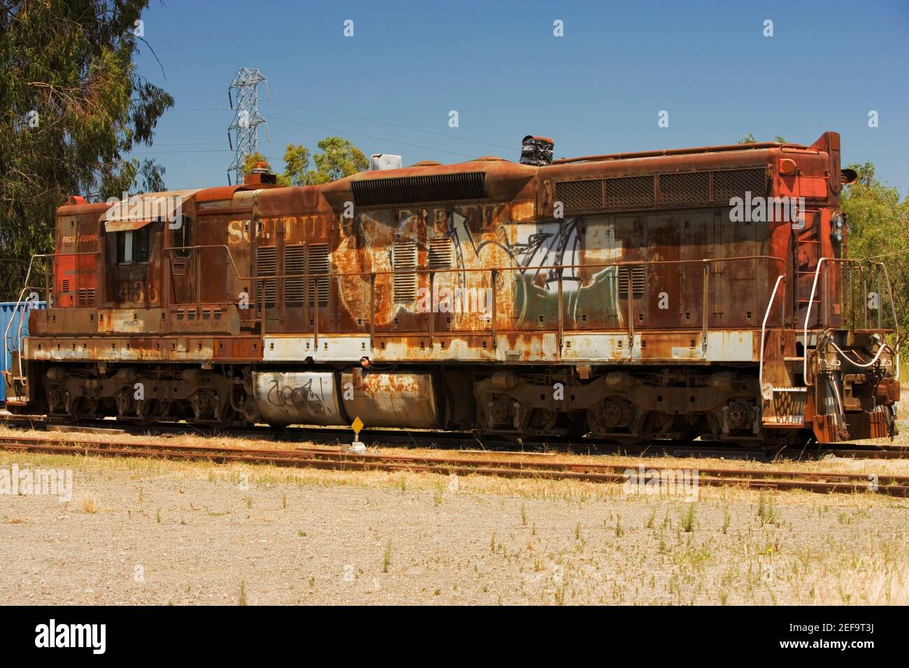Abandoned train engine on railroad track Stock Photo - Alamy