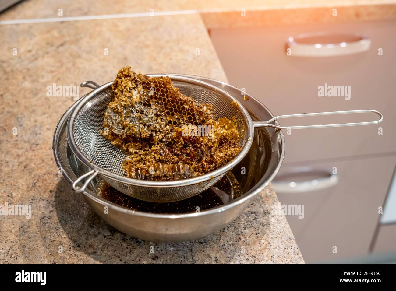 natural honey of wild bees on a sieve Stock Photo - Alamy