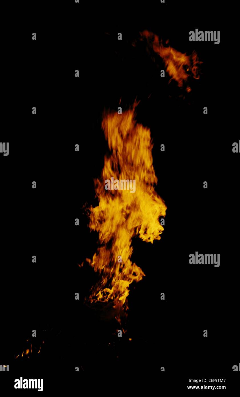 Flames of a fire at night Stock Photo - Alamy