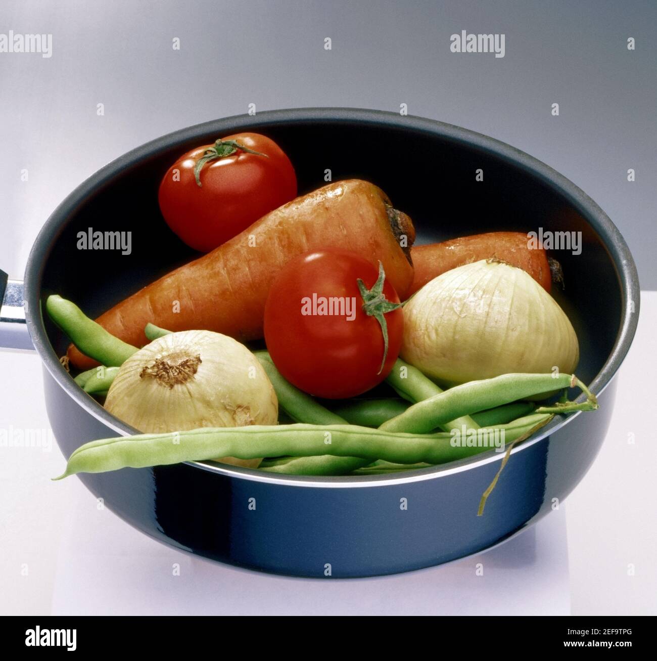 Frying vegetables in pan close hi-res stock photography and images - Alamy
