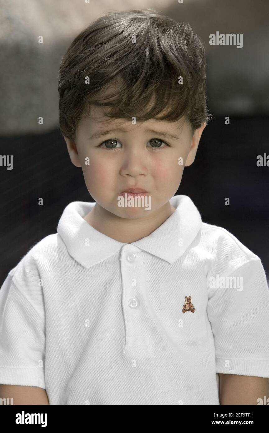 Portrait of a boy looking sad Stock Photo - Alamy