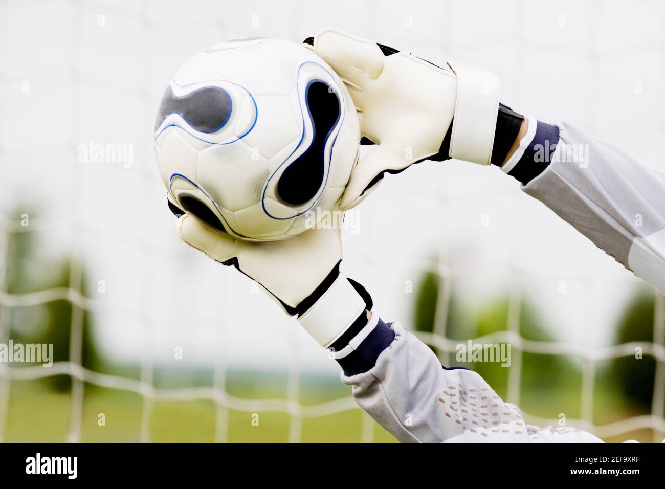 Soccer goalkeeper hands ball save hi-res stock photography and images ...