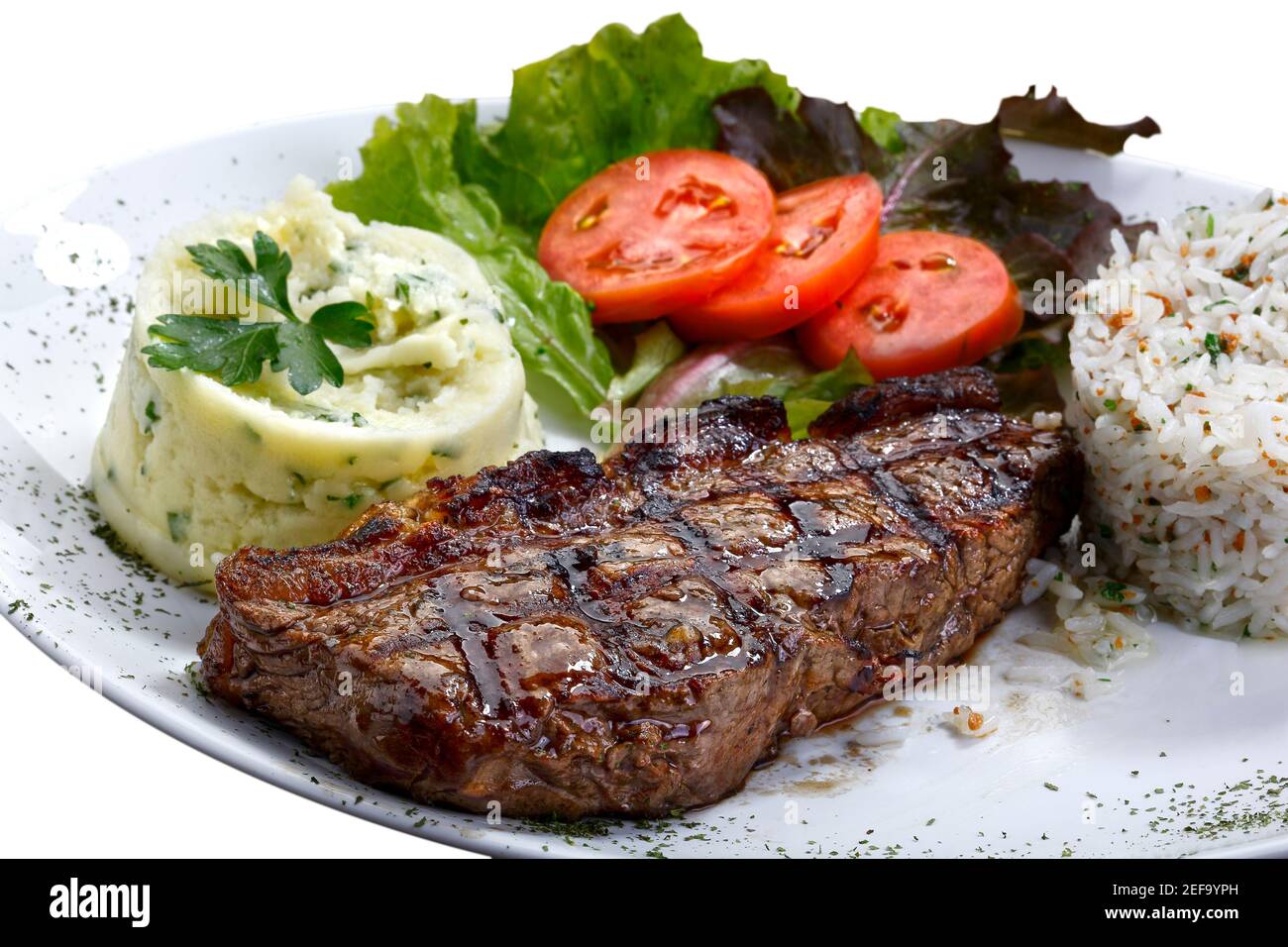 Beef steak with potatoes and rice in isolated white background Stock ...