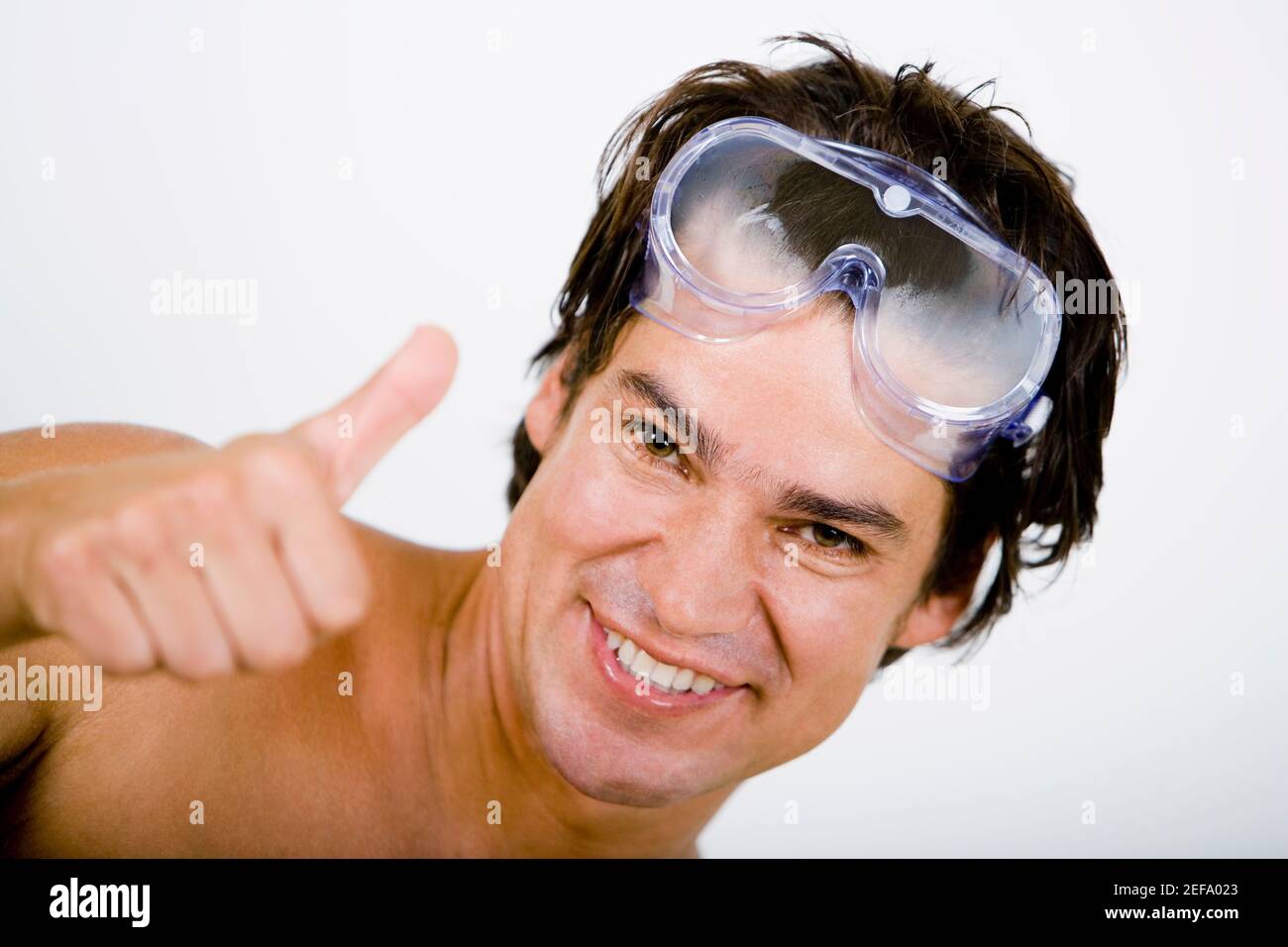 Portrait of a mid adult man showing Thumbs Up sign Stock Photo - Alamy