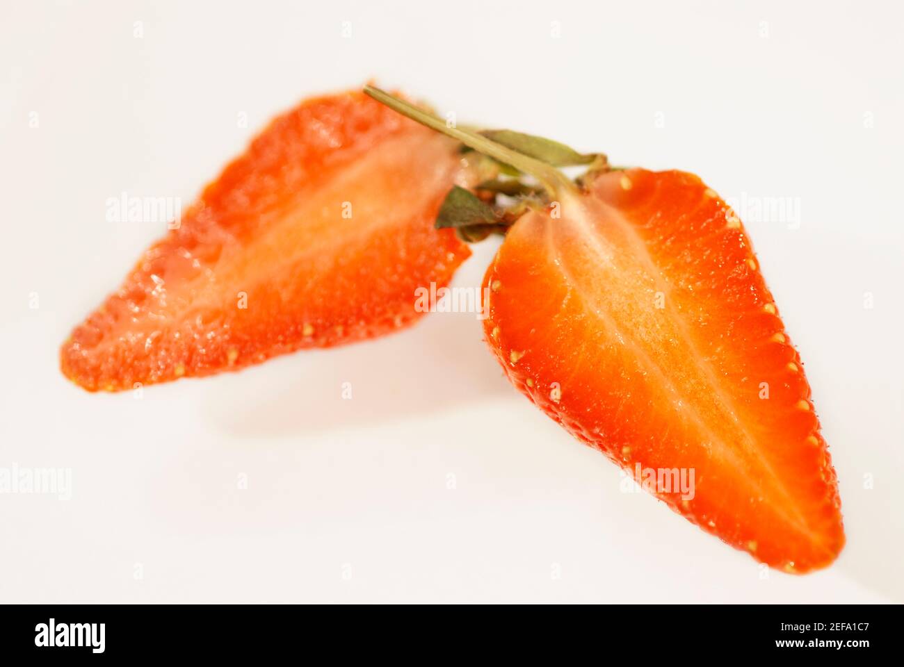 Strawberry cut in half hi-res stock photography and images - Alamy