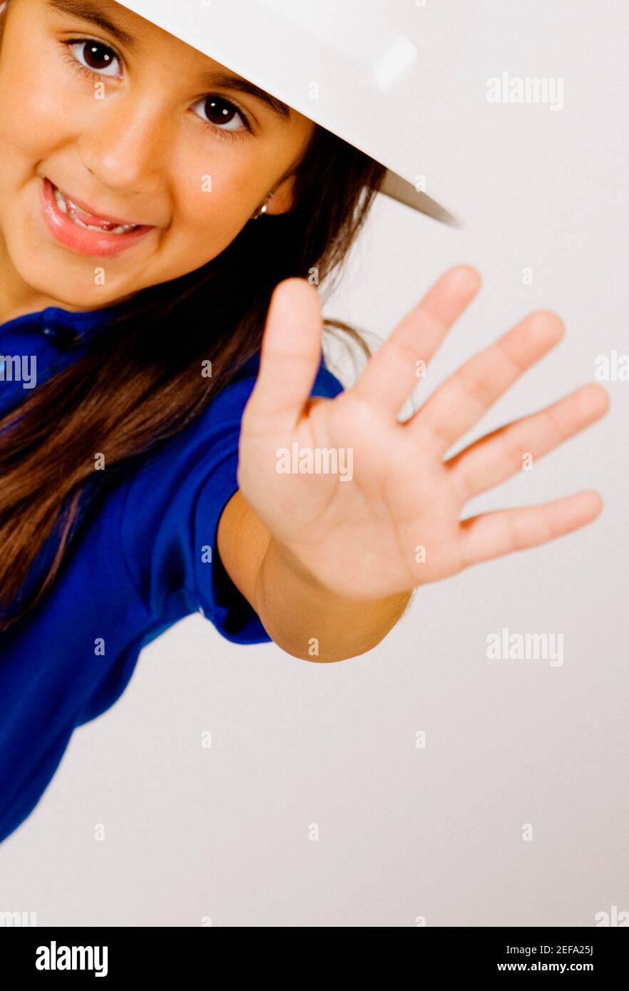 Portrait of a girl making a stop hand gesture Stock Photo - Alamy