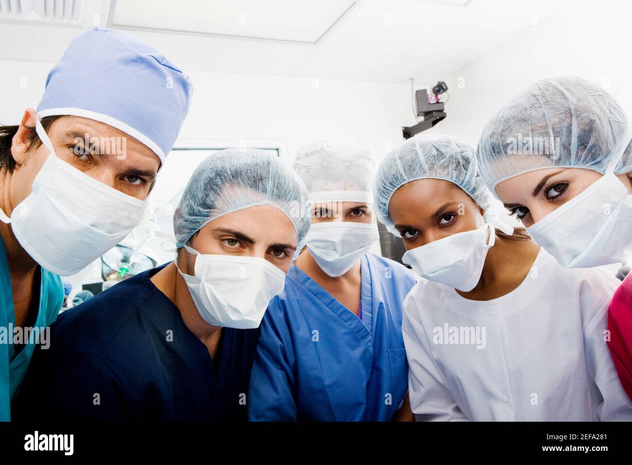 Portrait of surgeons standing in an operating room Stock Photo - Alamy