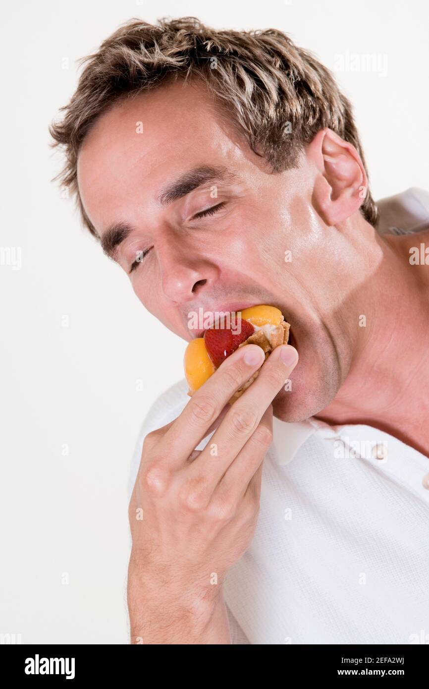 Male eating fruit with open mouth hi-res stock photography and images ...