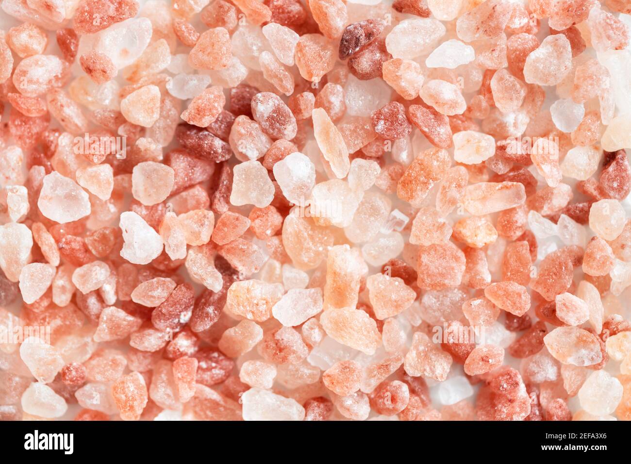 Background with Himalayan pink rock salt. Top view Stock Photo - Alamy