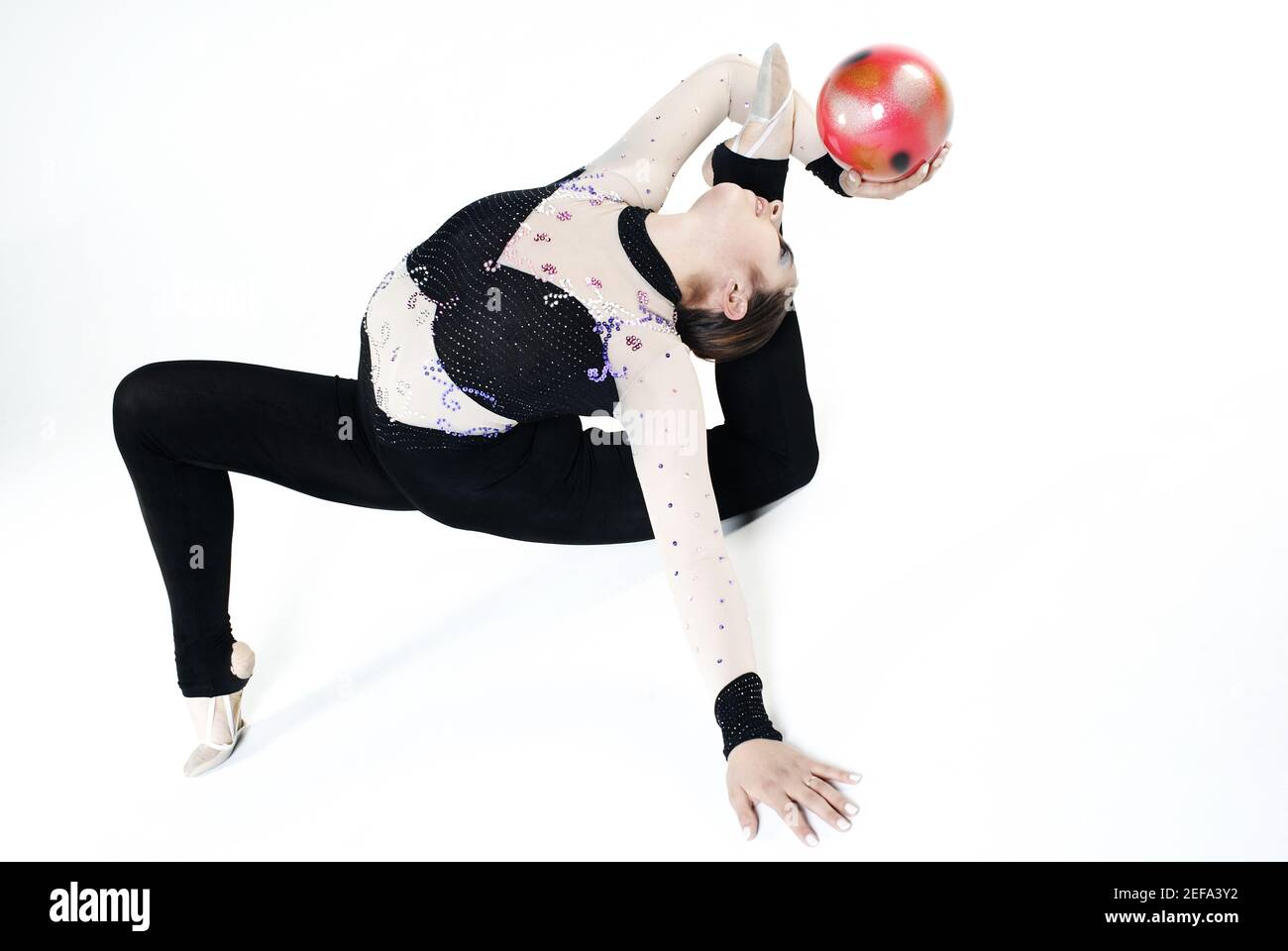 Female gymnast practicing with a ball Stock Photo - Alamy
