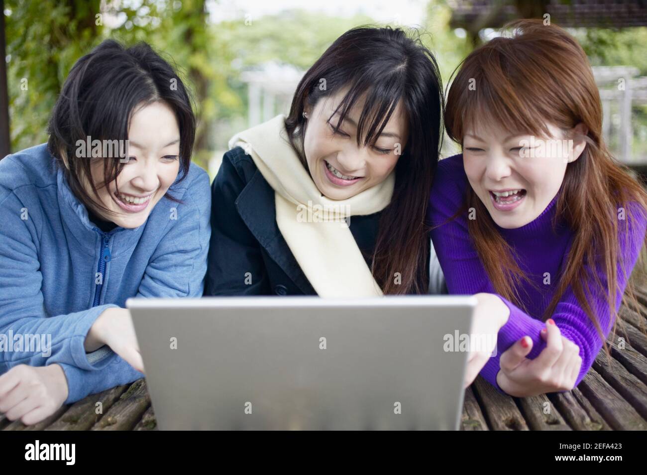 Three young women smiling Stock Photo - Alamy