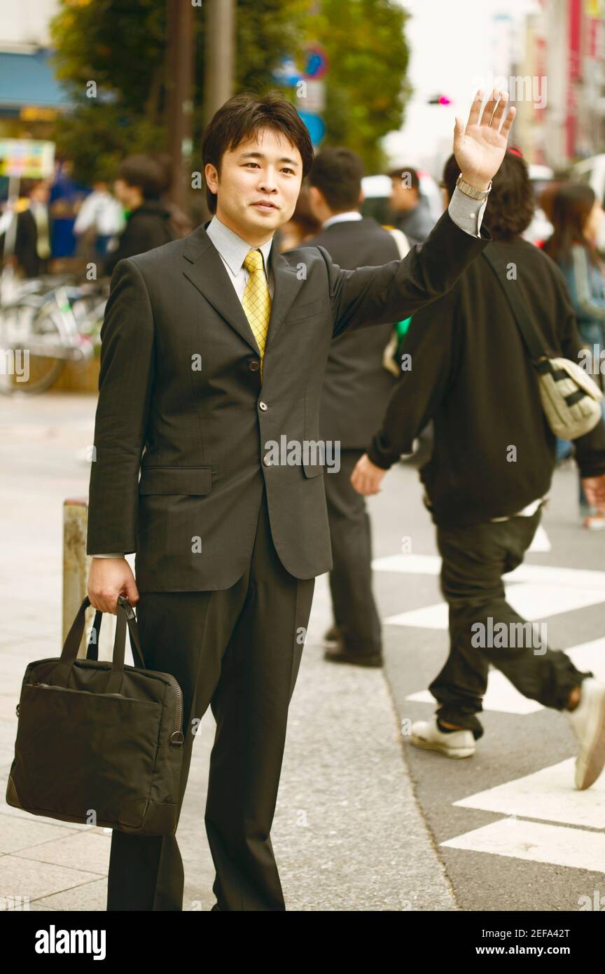 Businessman making a stop sign Stock Photo - Alamy