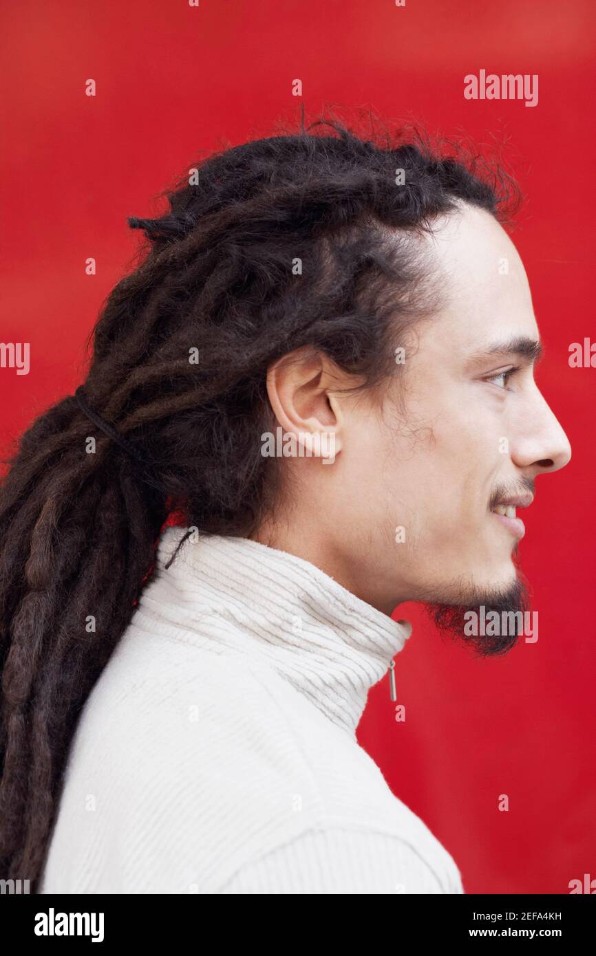 Side profile of a young man smiling Stock Photo - Alamy