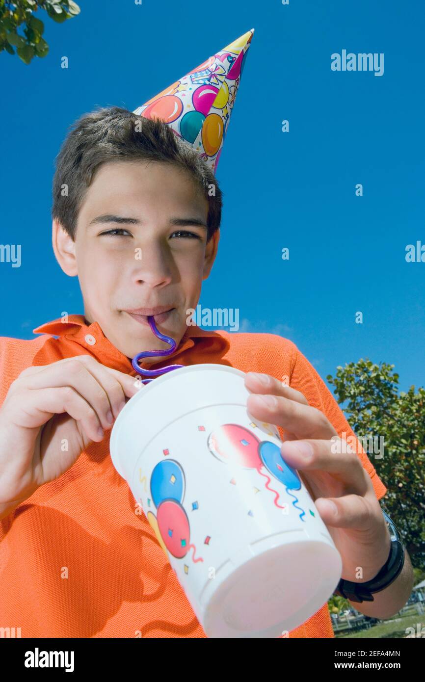 Boy drinking from blue cup hi-res stock photography and images - Alamy