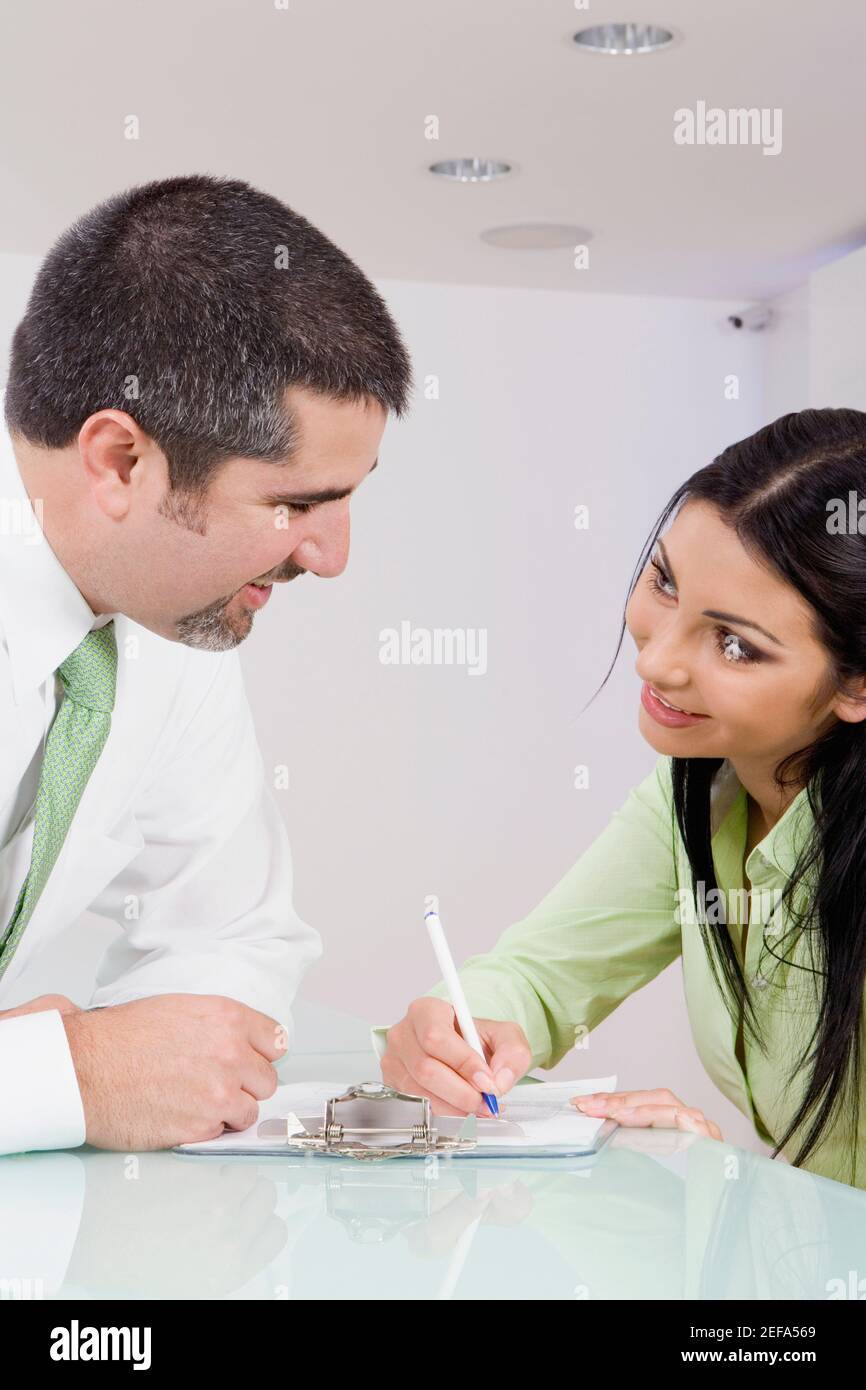 Office interior two people talking to each other hi-res stock ...