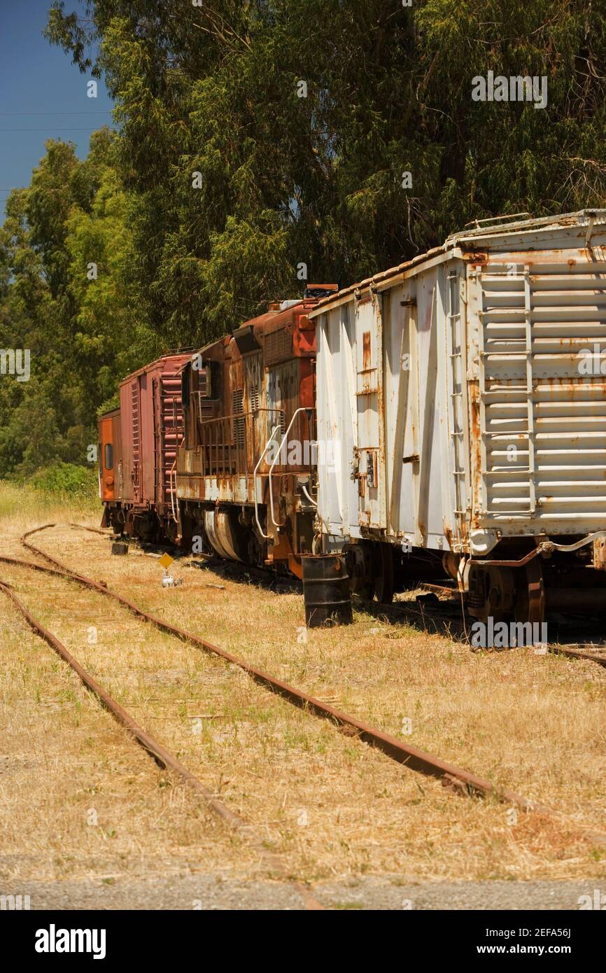 Abandoned freight train on railroad track Stock Photo - Alamy