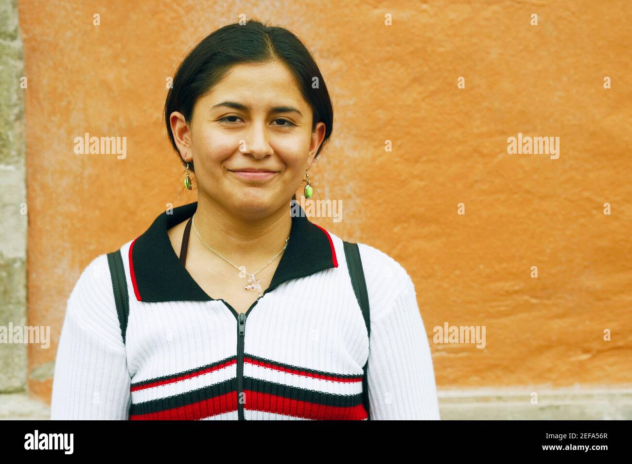 Portrait of a woman smirking hi-res stock photography and images - Alamy