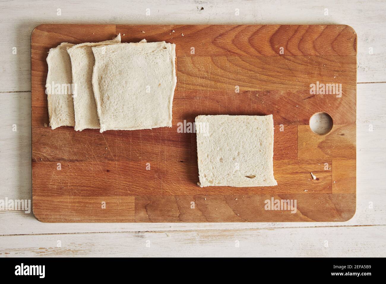 Top view of toasts with no crust for rolls on a wooden board on the ...