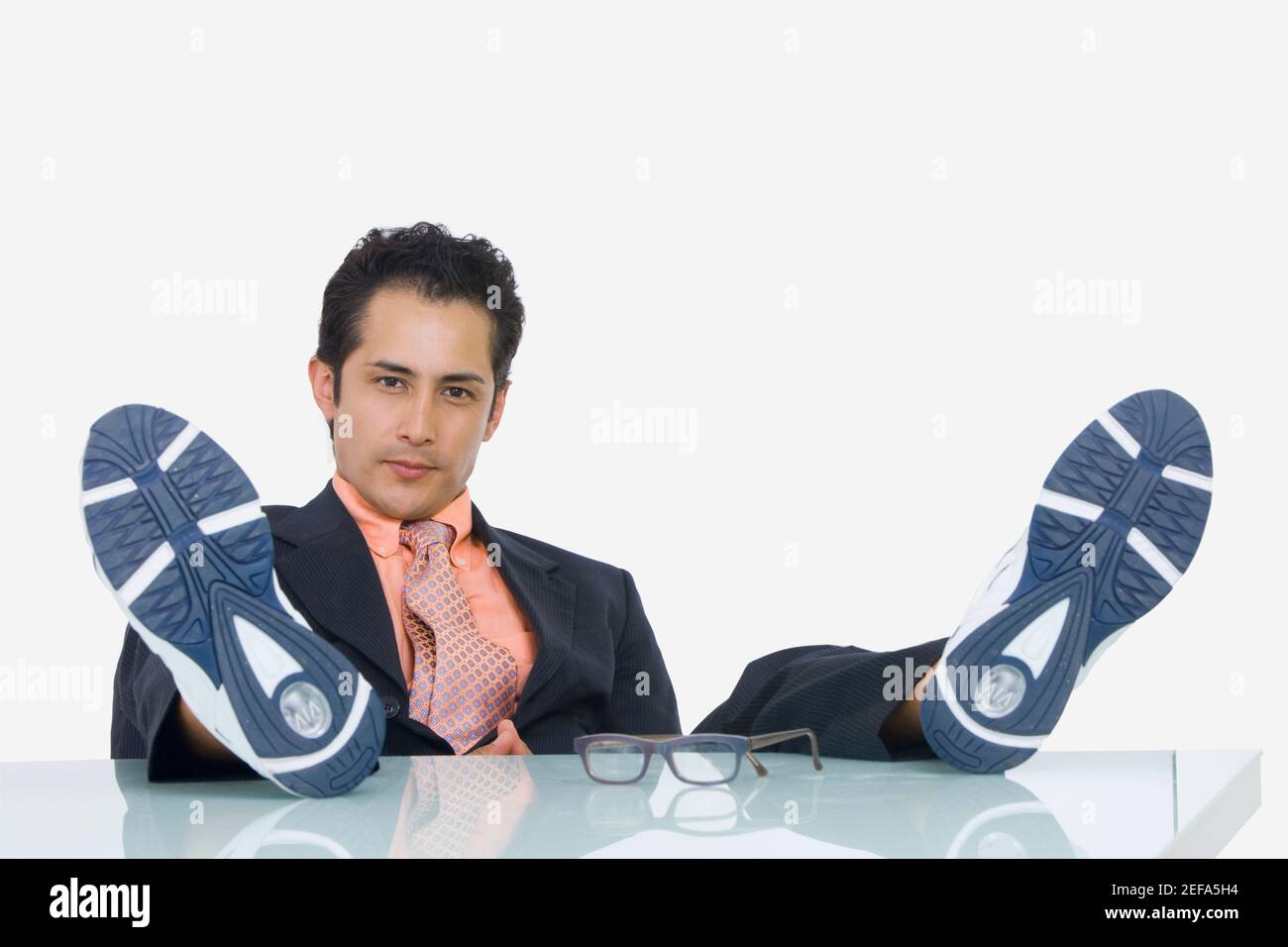 Man sitting table feet up resting hi-res stock photography and images ...