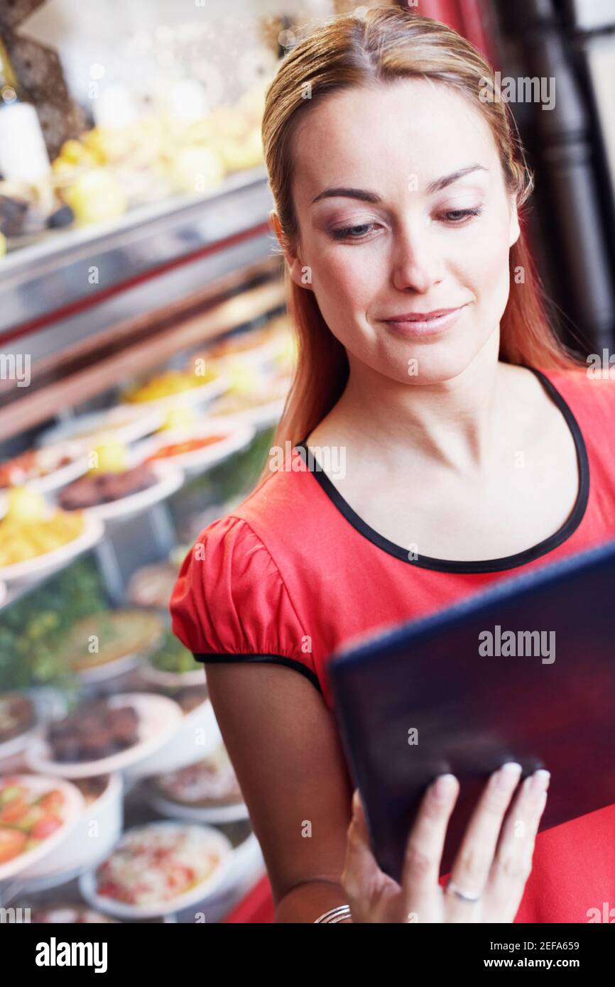 Woman reading a menu hi-res stock photography and images - Alamy