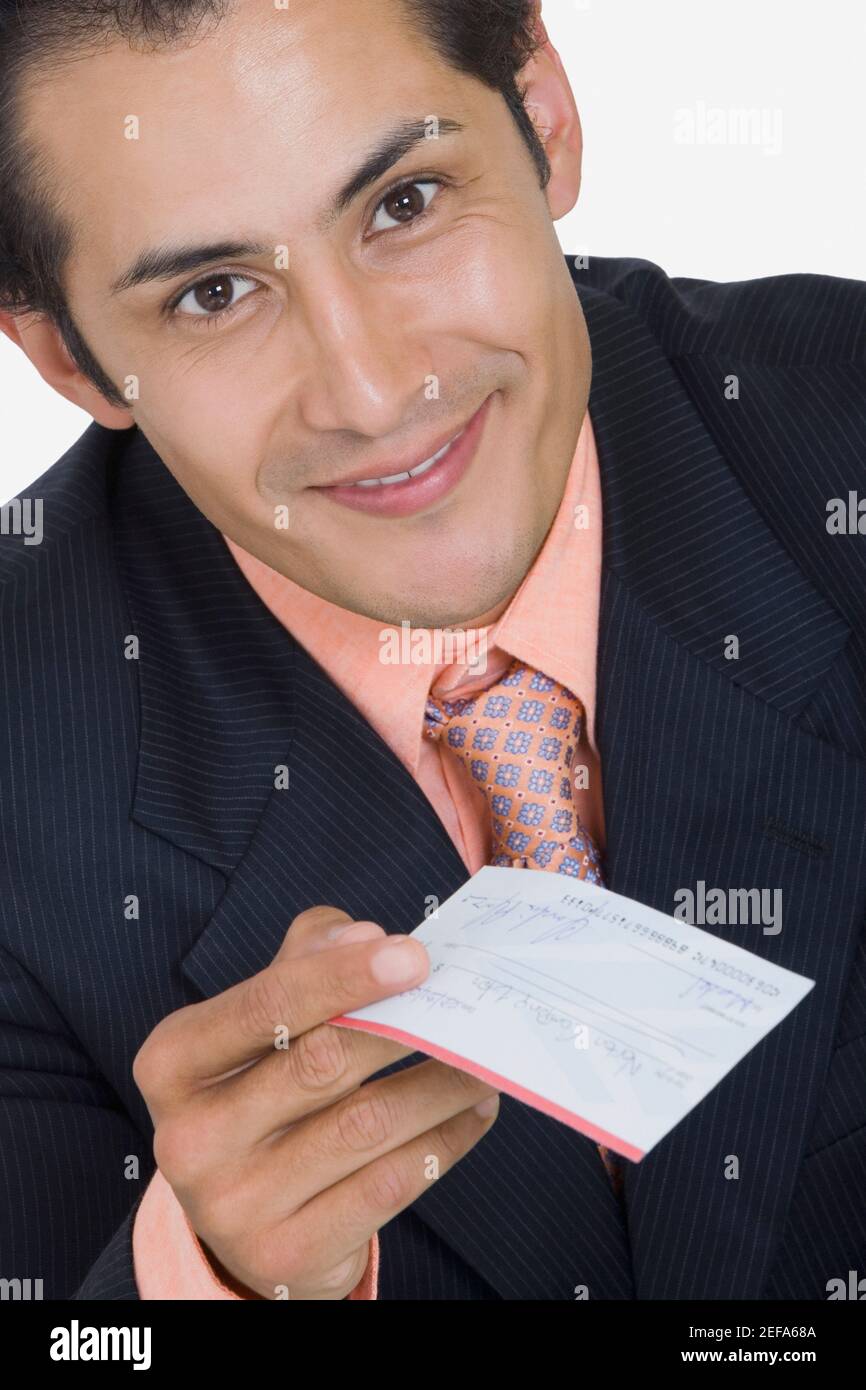 Portrait of a businessman holding a check and smiling Stock Photo - Alamy
