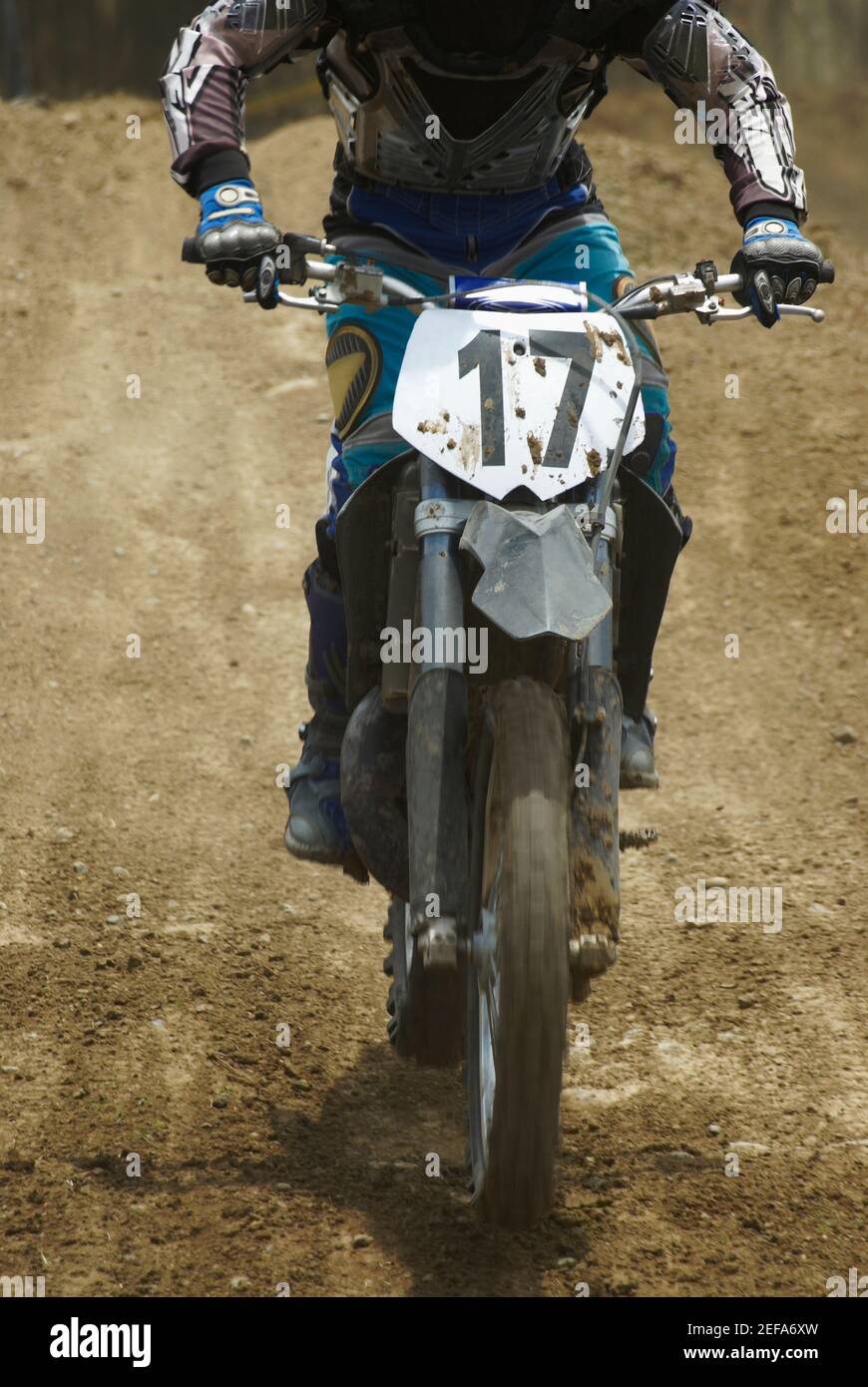 Motocross rider riding a motorcycle Stock Photo - Alamy